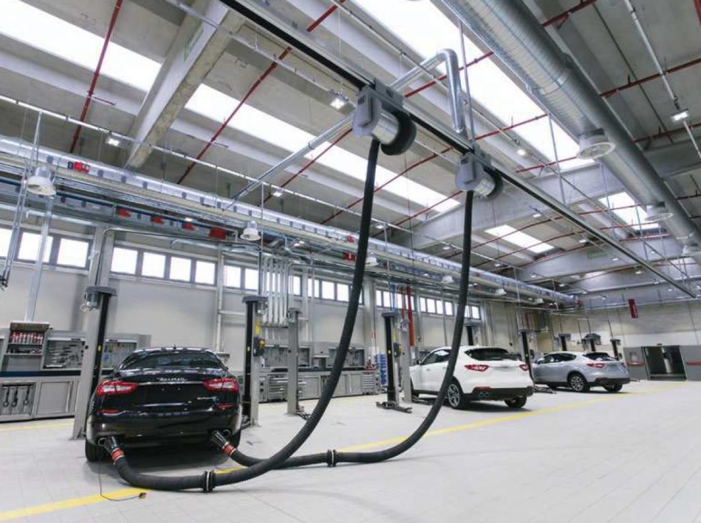 Vehicle exhaust extraction with reel, trolley or rail also for trucks